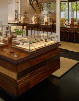 China Wabi-Sabi Dark Walnut Natural Texture LED Jewelry Display Cases High End Custom Glass Showcases Solid Wood Base Retail Store for sale