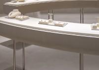 China Minimalist Curved LED Jewelry Island Display Case High End Custom Jewelry Showcase Open Top Stainless Steel Legs Store for sale