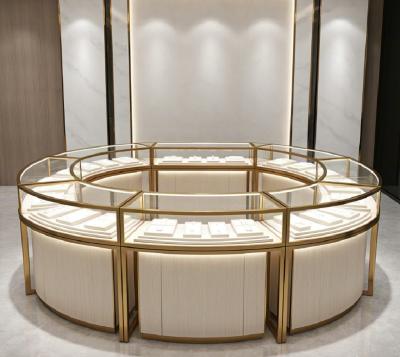 China Circular Modular Modern Luxury Jewelry Island Counter | Brushed Gold Wood Grain | LED Tempered Glass Showcase for sale