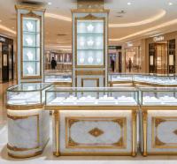 China European Aluminium Jewelry Display Counter | White Marble Gold Carved | LED Curved Glass Showcase for Mall Retail Stores for sale