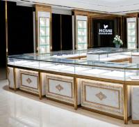 China European Aluminium Jewelry Display Counter | White Marble Gold Carved | LED Curved Glass Showcase for Mall Retail Stores for sale