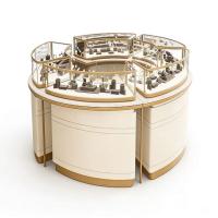 China Luxury Curved C-Shaped Jewelry Display Table | Beige Body Brushed Gold Metal Frame Marble Top | Curved Glass Showcase for sale