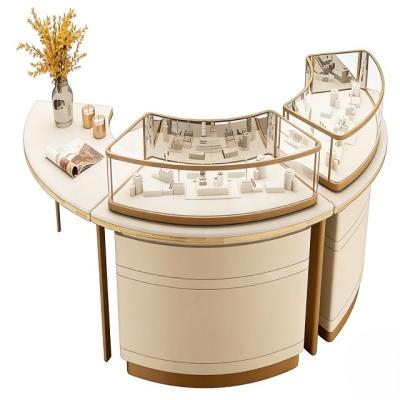 China Luxury Curved Jewelry Display Counter | Beige Body Brushed Gold Metal Frame Side Table | Curved Glass Showcase Built-in for sale