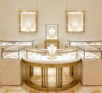 China Luxury Curved Jewelry Display Cabinet LED Lighting | Cream Color Gold Metal Frame | Custom High-End Showcase for Jewelry Malls for sale