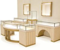 China Luxury Curved Jewelry Display Cabinet LED Lighting | Cream Color Gold Metal Frame | Custom High-End Showcase for Jewelry Malls for sale