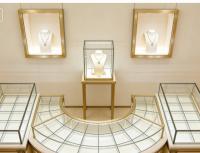 China Luxury Curved Jewelry Display Cabinet LED Lighting | Cream Color Gold Metal Frame | Custom High-End Showcase for Jewelry Malls for sale