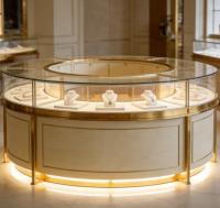 China Luxury Curved Jewelry Display Cabinet LED | Cream Color Solid Wood Gold Metal Frame | Middle Island Counter High-End Jewelry for sale