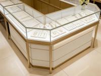 China High-End Custom L-Shaped Jewelry Island Counter Premium White Lacquer Gold Plated Metal Glass Showcase LED Lighting Durable Easy for sale