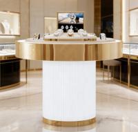 China High-End Gold Finish Round Watch Display Counter with LED Illuminated Base Jewelry Showcase Built-in Screen for Retail for sale