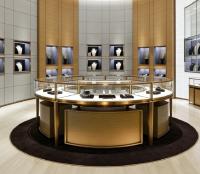 China Luxury Jewelry Island Display Counter Custom Curved Glass Showcase Gold Trim LED Lighting Durable Easy Clean High-End for sale