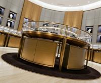 China Luxury Jewelry Island Display Counter Custom Curved Glass Showcase Gold Trim LED Lighting Durable Easy Clean High-End for sale