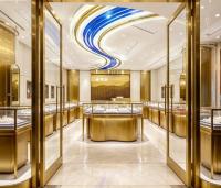 China Luxury Champagne Gold Curved Jewelry Display Case, Premium Glass Showcase with LED Lighting for High-End Jewelry Boutiques for sale