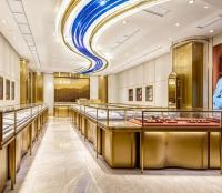 China Luxury Champagne Gold Curved Jewelry Display Case, Premium Glass Showcase with LED Lighting for High-End Jewelry Boutiques for sale