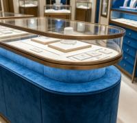 China Luxury Red/Blue & Gold Jewelry Island Display Counter, Premium Curved Glass Showcase for High-End Jewelry Retail for sale