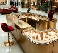 China Luxury Champagne Gold Curved Jewelry Island Service Counter Display Cabinet, High-End Glass Showcase for Fine Jewelry Retail for sale
