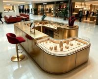 China Luxury Champagne Gold Curved Jewelry Island Service Counter Display Cabinet, High-End Glass Showcase for Fine Jewelry Retail for sale