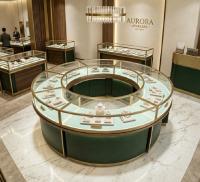 China Luxury Emerald Green Gold Frame Round Island Jewelry Display Cabinet, Premium Tempered Glass Showcase for Luxury Jewelry Retail for sale