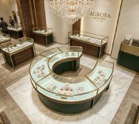 China Luxury Emerald Green Gold Frame Round Island Jewelry Display Cabinet, Premium Tempered Glass Showcase for Luxury Jewelry Retail for sale