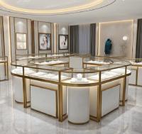 China Custom Luxury Round Jewelry Display Counter, Premium Gold Stainless Steel & Glass Showcase for High-End Jewelry Boutique for sale