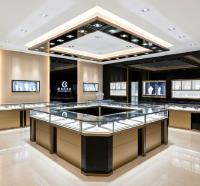 China Custom Luxury Square Jewelry Display Counter, Premium Gold & Black Stainless Steel Glass Showcase for High-End Jewelry Boutique for sale