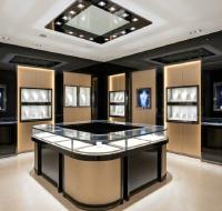 China Custom Luxury Square Jewelry Display Counter, Premium Gold & Black Stainless Steel Glass Showcase for High-End Jewelry Boutique for sale