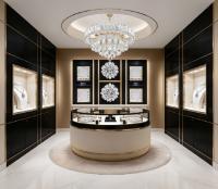 China Luxury Jewelry Island Display Counter Custom Beige Black Showcase Gold Trim Crystal Chandelier Style LED Lighting Showroom for sale