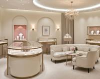 China Elegant Round LED Lit Metal Jewelry Display Case Cream Base Gold Frame Glass Top for Luxury Mall Retail for sale