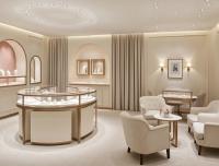 China Elegant Round LED Lit Metal Jewelry Display Case Cream Base Gold Frame Glass Top for Luxury Mall Retail for sale