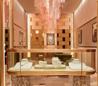 China Complete Luxury Jewelry Store Furniture Set | Curved Island Counter + Reception Desk + Wall Mounted Showcase | Pink Gold Finish for sale