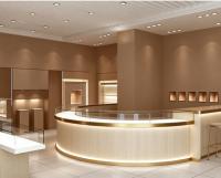 China Complete Set Luxury Iron Jewelry Store Furniture | Curved Middle Island Counter + Wall-Mounted LED Lit Showcase + Cashier for sale