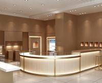 China Complete Set Luxury Iron Jewelry Store Furniture | Curved Middle Island Counter + Wall-Mounted LED Lit Showcase + Cashier for sale