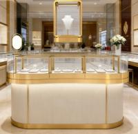 China Luxury Modern Curved Glass Jewelry Display Case with Gold Trim Premium Boutique Showcase for Fine Jewelry in Shopping Malls for sale