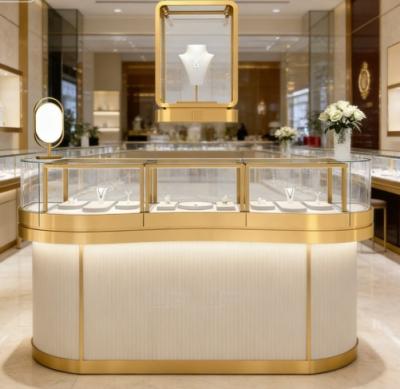 China Luxury Modern Curved Glass Jewelry Display Case with Gold Trim Premium Boutique Showcase for Fine Jewelry in Shopping Malls for sale