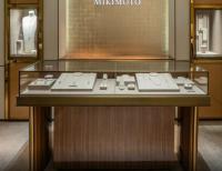 China Luxury Warm Tone LED Lighting Jewelry Display Cases High End Custom Glass Showcases with Gold Trim for Pearl Jewelry Store for sale