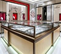China Custom Luxury Jewelry Store New Chinese Red & Gold Glass Island Display Cabinet for sale
