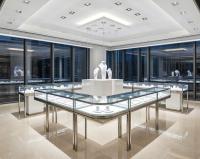 China Freestanding Iron Frame Jewelry Display Counter with Premium Glass LED Lighting Customizable Design for Luxury Shopping Malls for sale