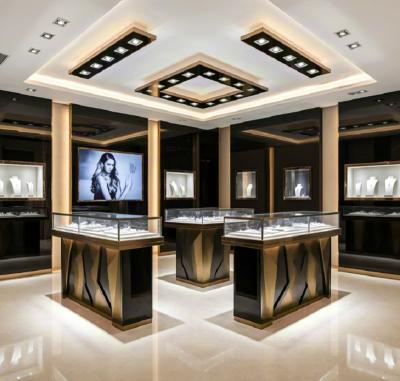 China Custom Luxury Geometric Jewelry Display Counter Premium Black Gold Stainless Steel Glass Showcase High-End Jewelry Boutique Mall for sale