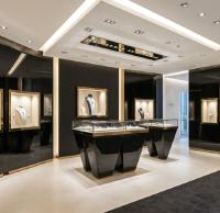 China Custom Luxury Geometric Jewelry Display Counter Premium Black Gold Stainless Steel Glass Showcase High-End Jewelry Boutique Mall for sale