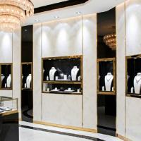 China Modern LED Lit Jewelry Display Counter White & Gold Glass Showcase for Luxury Jewelry Retail in Shopping Malls for sale