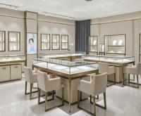 China Modern Luxury Jewelry Display Counter Set with Gold Trim Tempered Glass Showcase and LED Lighting for Mall Use for sale