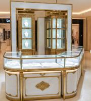 China European Aluminium Jewelry Display Counter | White Marble Gold Carved | LED Curved Glass Showcase for Mall Retail Stores for sale