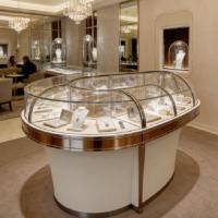China Luxury Curved Dome Jewelry Display Counter | White Body Polished Gold Trim | Curved Glass Showcase Shopping Mall Retail Store for sale