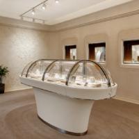 China Luxury Curved Dome Jewelry Display Counter | White Body Polished Gold Trim | Curved Glass Showcase Shopping Mall Retail Store for sale