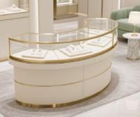 China Curved Arc High Quality Jewelry Display Counter | Cream Body Gold Trim | Glass Showcase LED Lights Retail Store Shopping Mall for sale