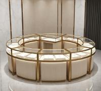 China Circular Modular Modern Luxury Jewelry Island Counter | Brushed Gold Wood Grain | LED Tempered Glass Showcase for sale