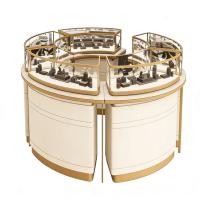 China Luxury Curved C-Shaped Jewelry Display Table | Beige Body Brushed Gold Metal Frame Marble Top | Curved Glass Showcase for sale