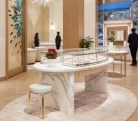 China Luxury Curved Jewelry Display Table | Calacatta Marble Base Aluminium Metal Frame | Oval Glass Showcase Built-in LED Showroom for sale