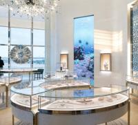 China Luxury Curved Jewelry Display Cabinet | White Pearl Finish Gold Metal Frame | Curved Glass Showcase Built-in LED Showroom Mall for sale
