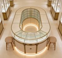 China Luxury Jewelry Display Cabinets LED Lighting Curved Island Customizable Design Aluminium/MDF Construction for Retail Stores for sale