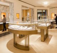 China Luxury S-Shaped Curved Jewelry Display Cabinet | Brushed Gold Metal Frame Marble Accents | Glass Showcase Mall Showrooms for sale